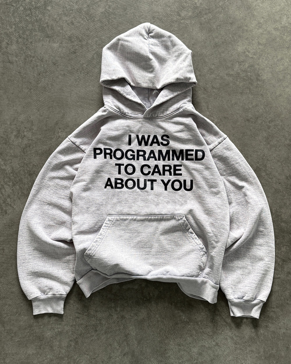 "PROGRAMMED TO CARE" HOODIE