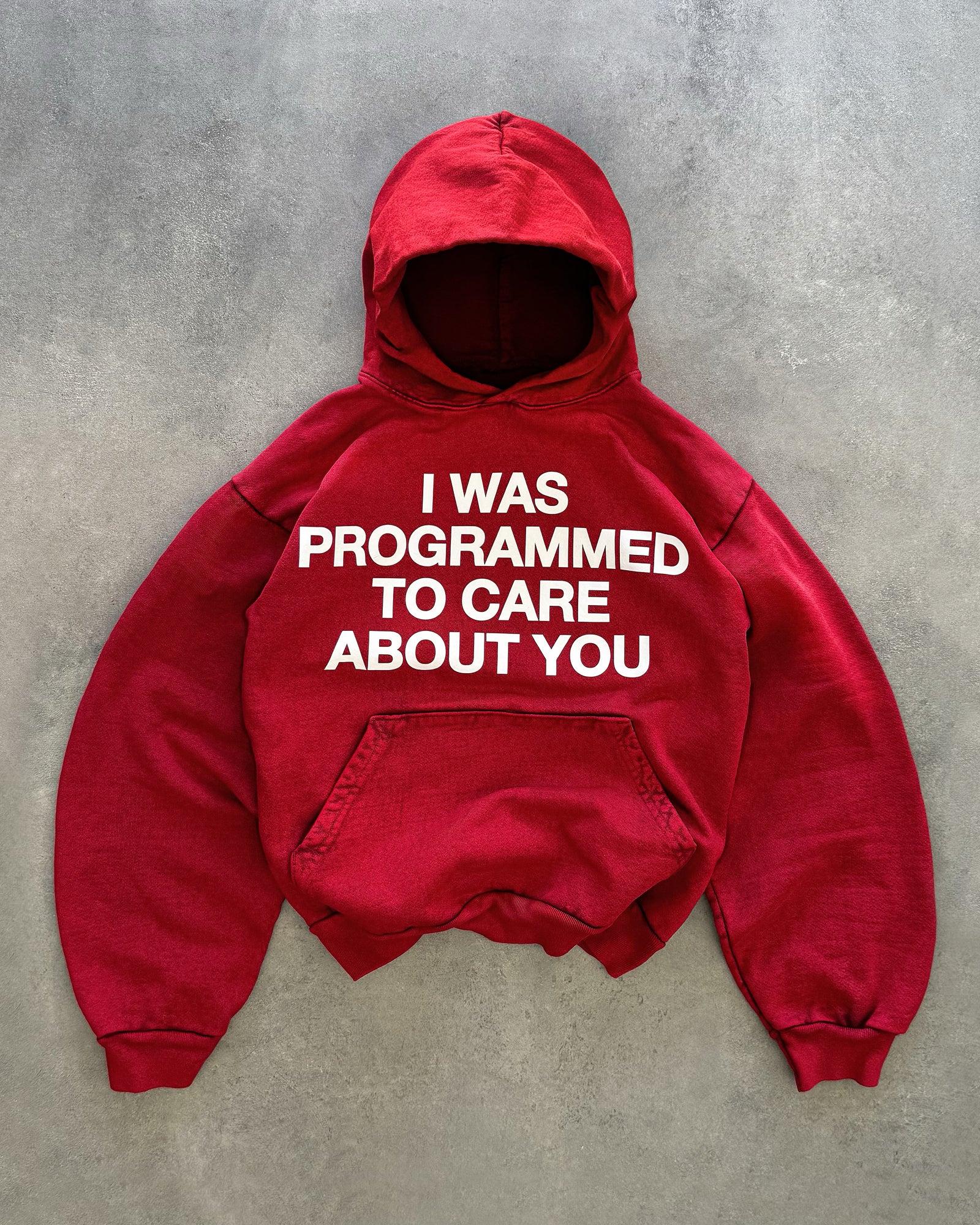 "PROGRAMMED TO CARE" HOODIE