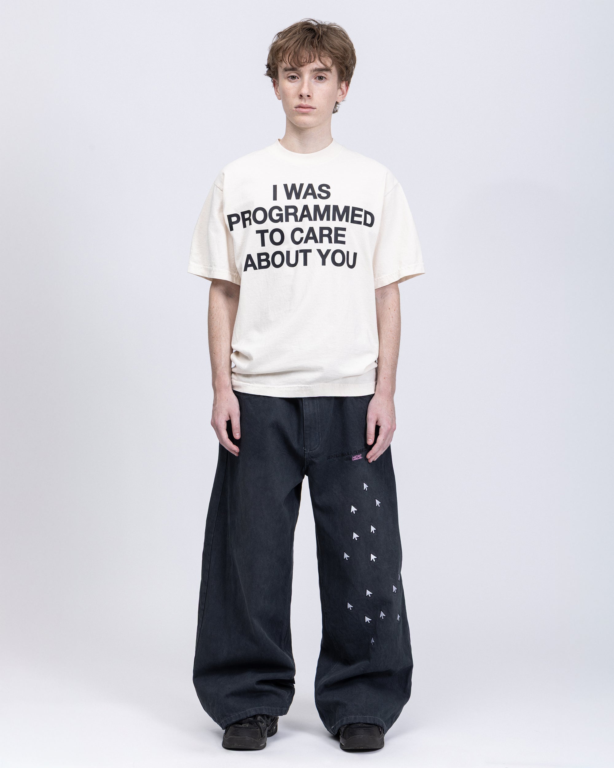 "PROGRAMMED TO CARE" T-SHIRT